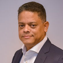 Eugene Rhuggenaath Executive Director